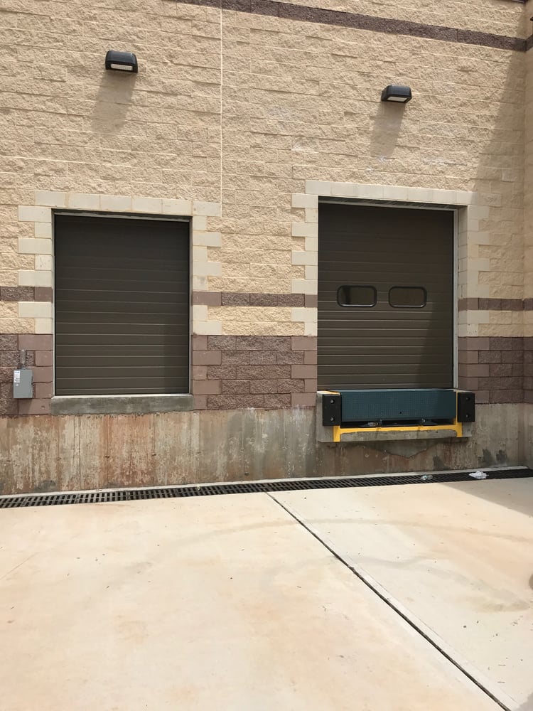 Extended Loading Dock Levelers & Tapered Dock Seals for Declining Driveways Extended Loading Dock Levelers & Tapered Dock Seals for Declining Driveways